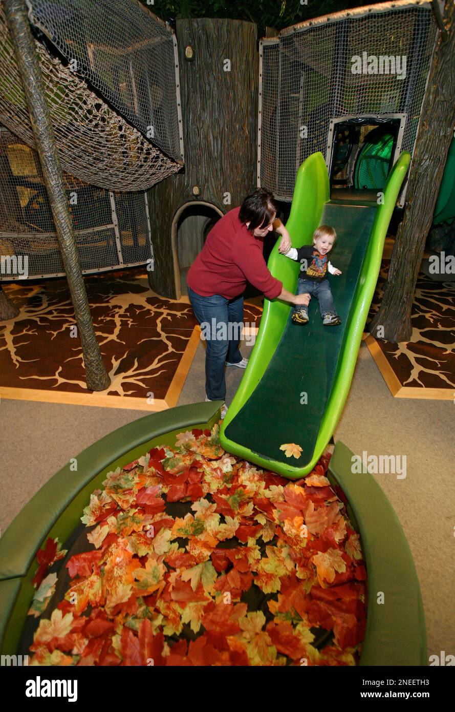 Brandon S. goes down the tree slide at Doubletree Hotels and Arbor Day ...