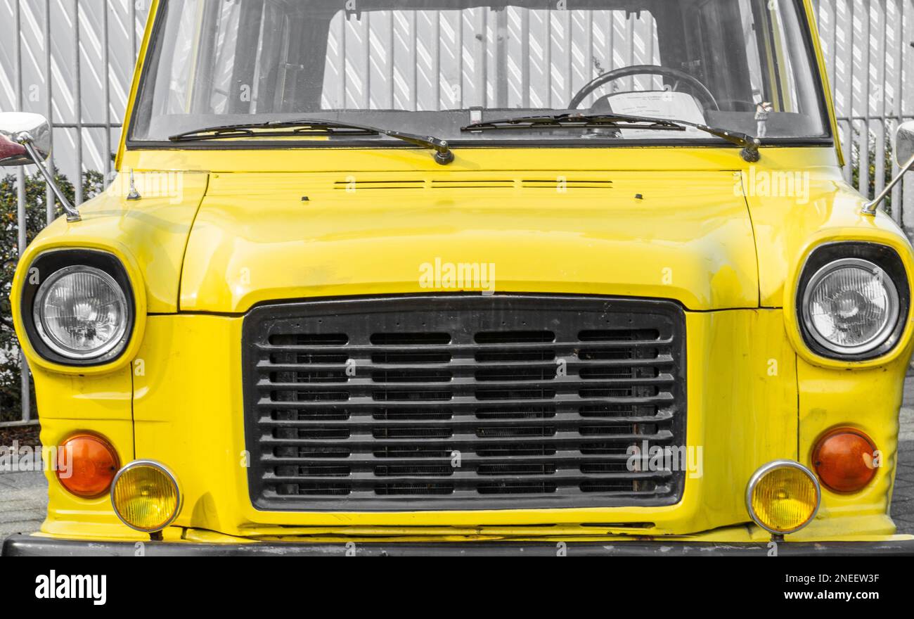 A front view of an old yellow 1978 Ford transit van parked on the ...