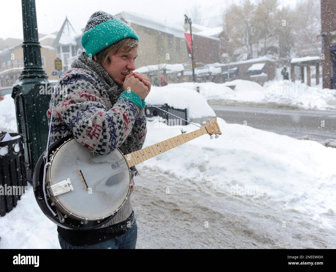 Chaz Prymek of the band Bramble warms his hands as he takes a break ...