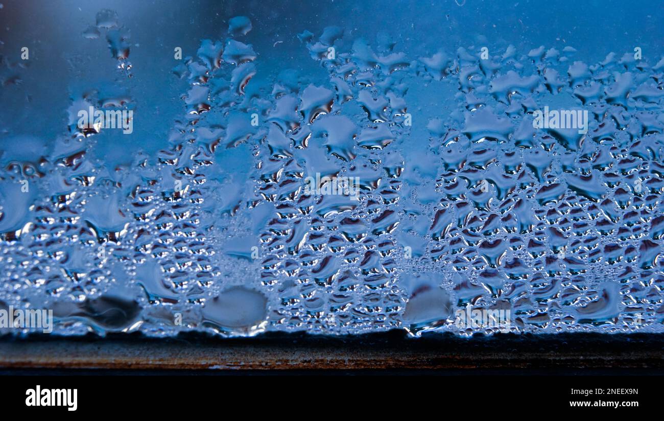 Drops of condensate on a window in winter Stock Photo - Alamy