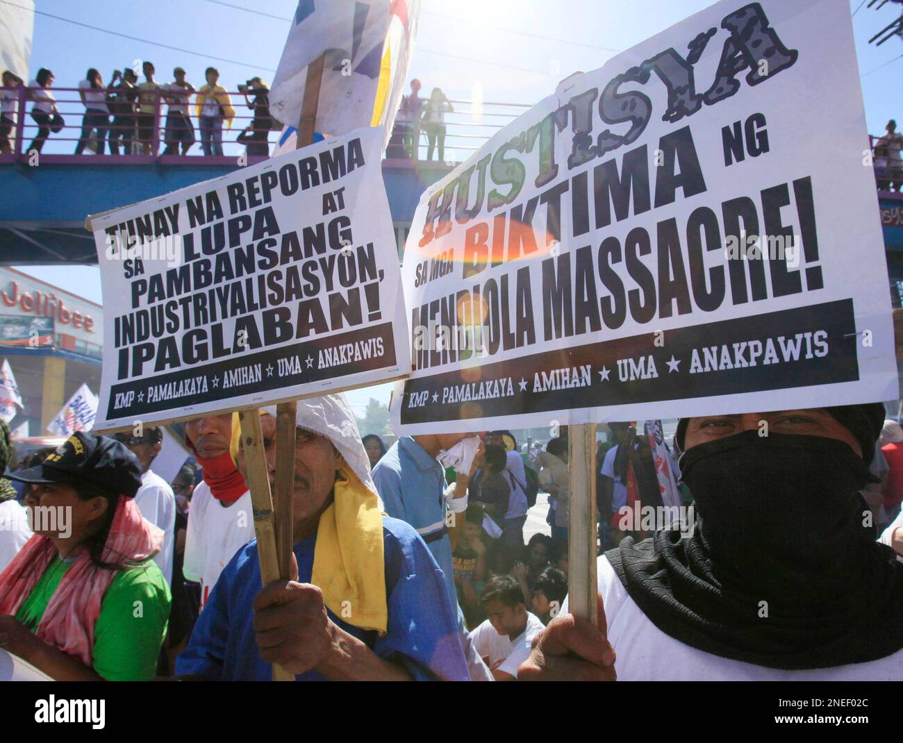 Protesters, mostly farmers, display placards during a rally at the ...
