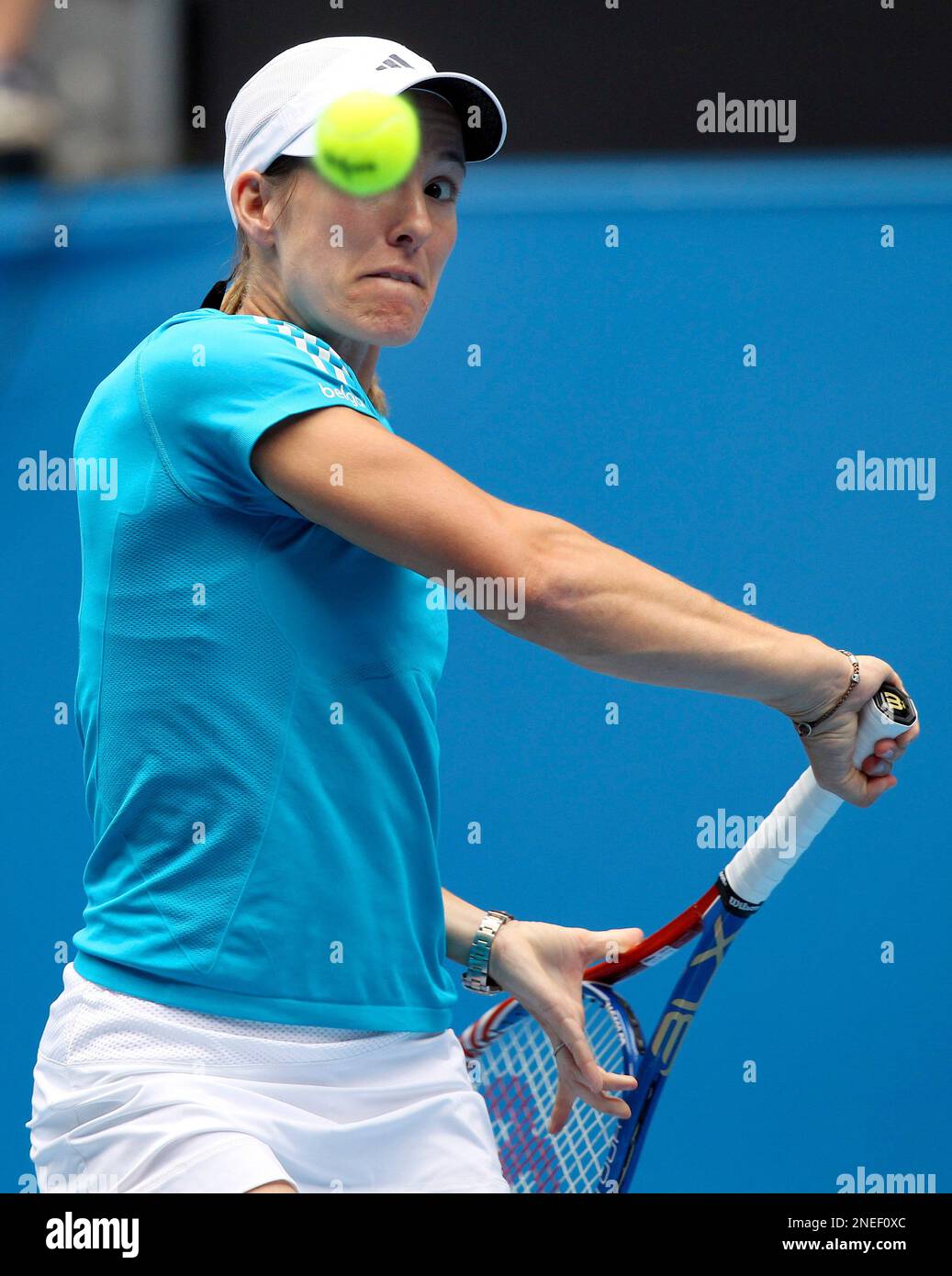 Justine Henin of Belgium returns to Russia's Alisa Kleybanova during ...