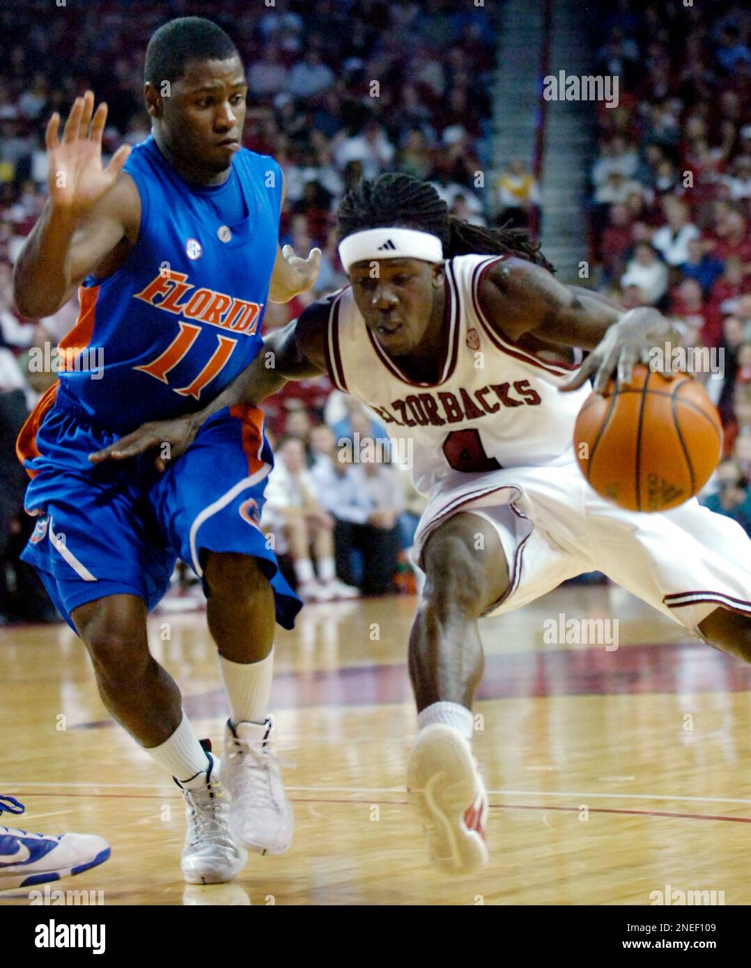 Arkansas' Courtney Fortson, right, drives against Florida's Erving ...