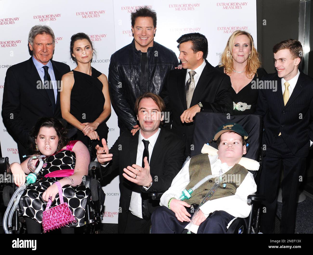 From left, actors Harrison Ford, Keri Russell and Brendan Fraser pose ...