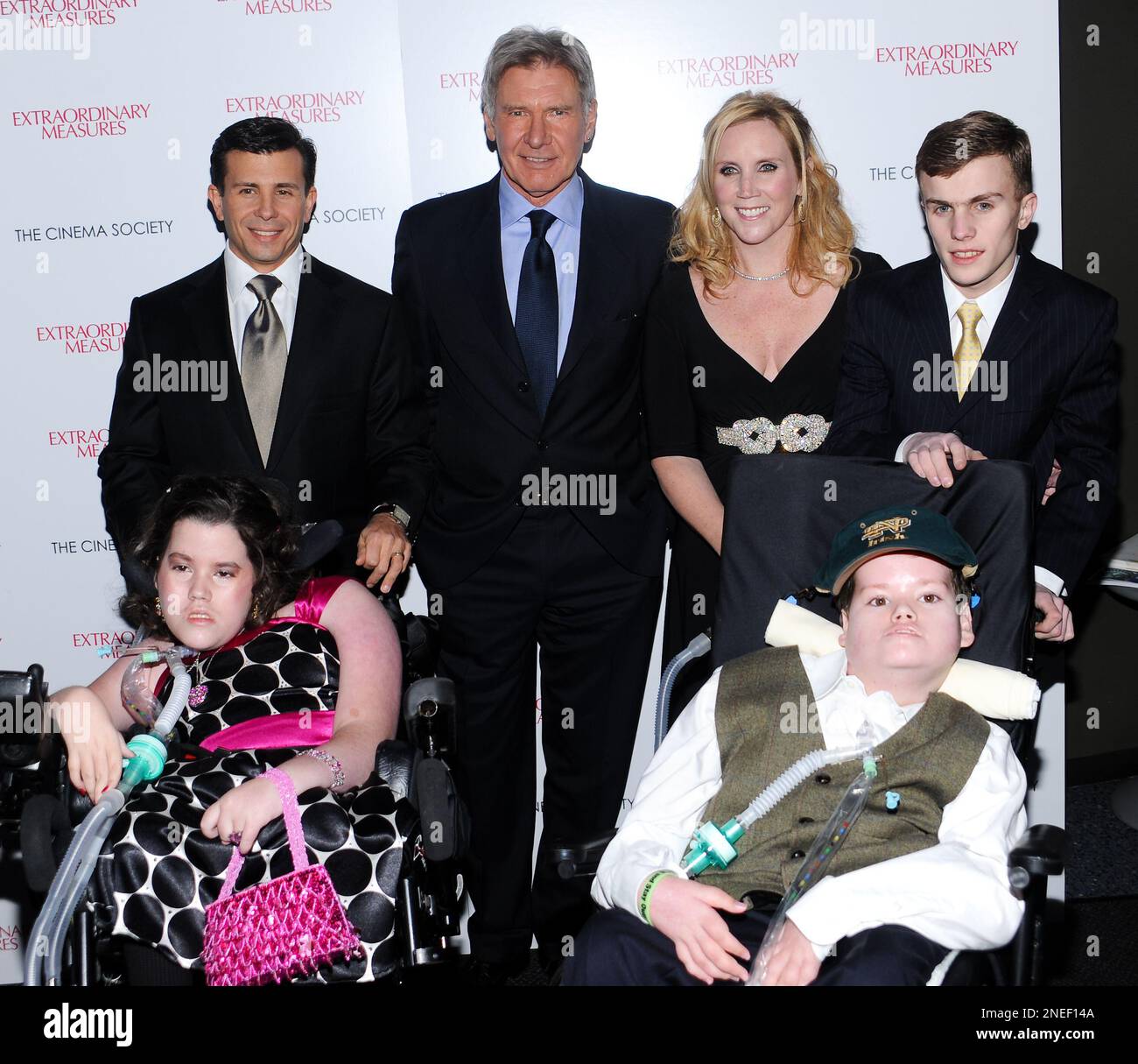 Actor Harrison Ford, center, poses with the real-life subjects of the ...