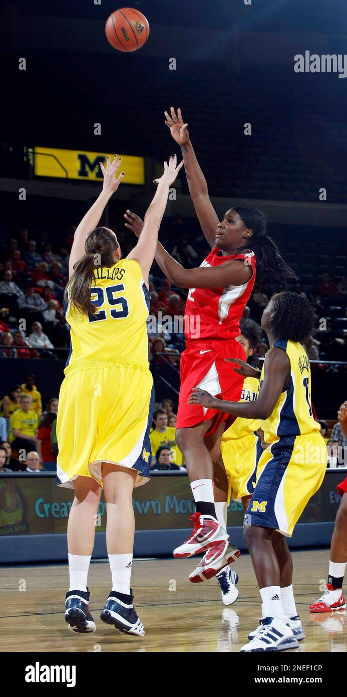 Ohio State center Jantel Lavender, center, shoots as Michigan center ...