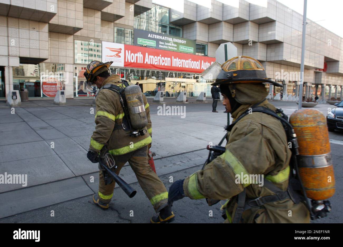 Firefighters walk to Cobo Center in Detroit, Thursday, Jan. 21, 2010 ...