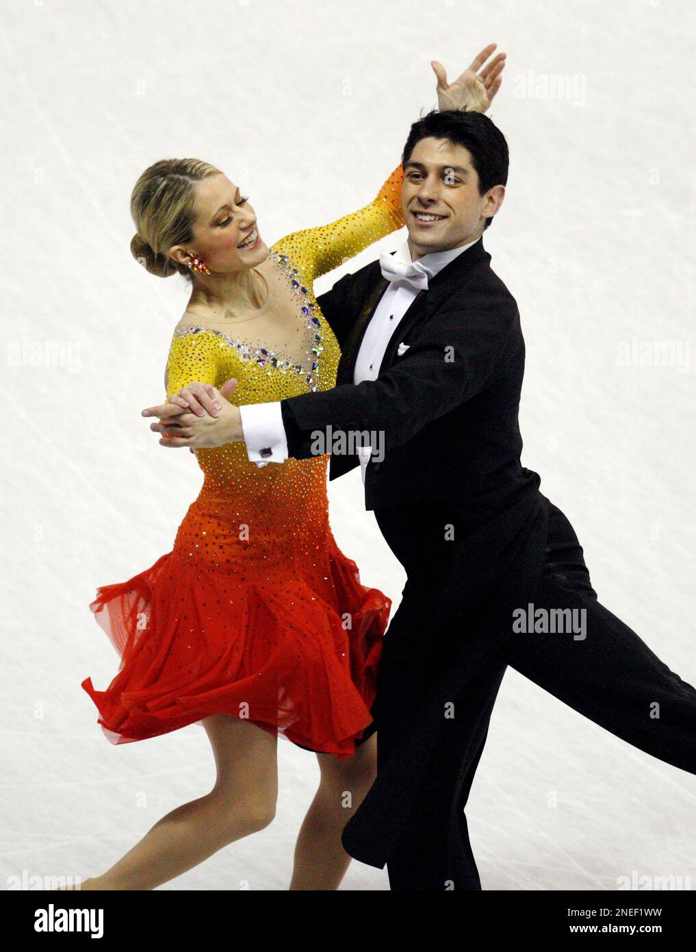 Kimberly Navarro and Brent Bommentre skate during their compulsory ice ...