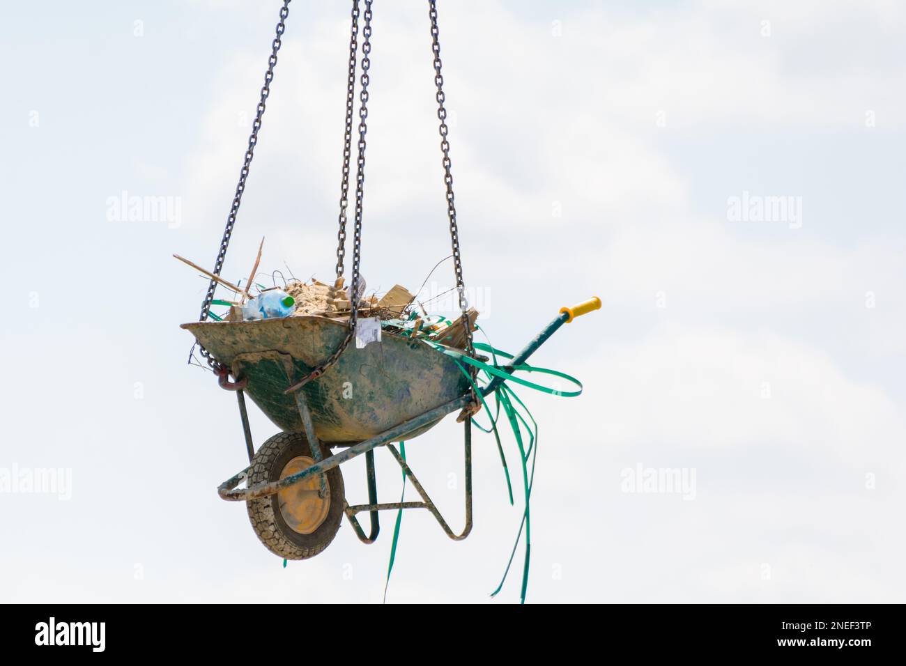 Close-up photo of a wheelbarrow with garbage Stock Photo - Alamy