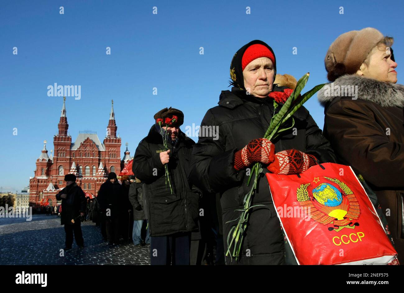 Russian Communists stand in line to visit the Mausoleum of Lenin, at ...
