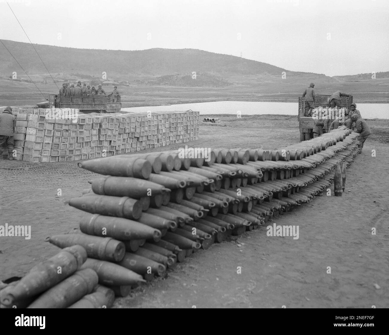 Korean supply troops load 155MM artillery shells aboard a truck which ...