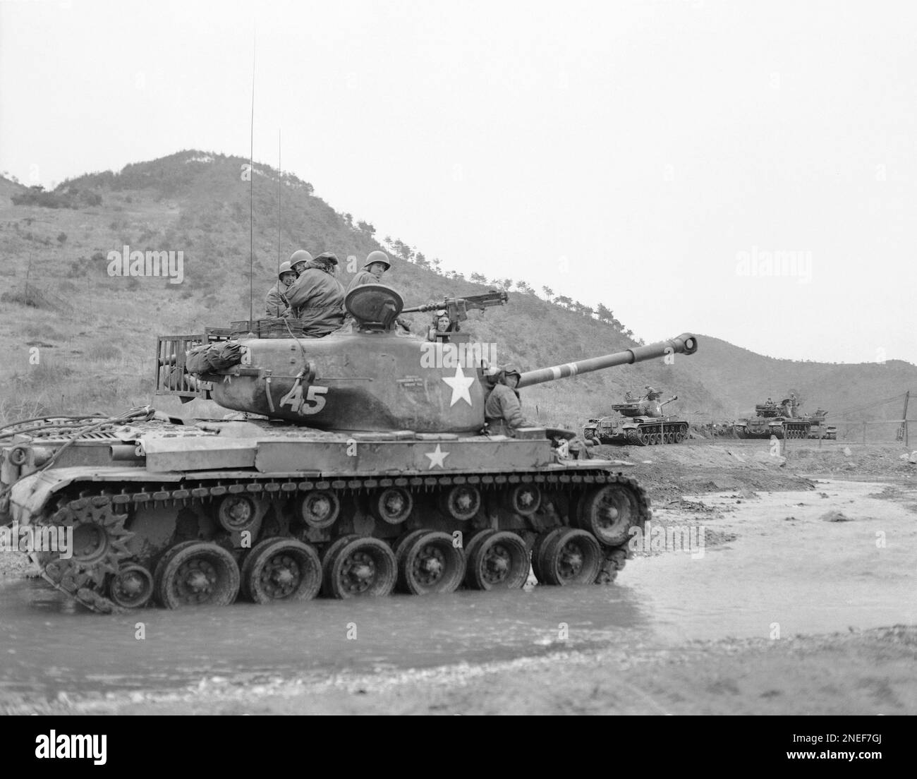 United Nations tanks move along a steam bed in preparation to ...