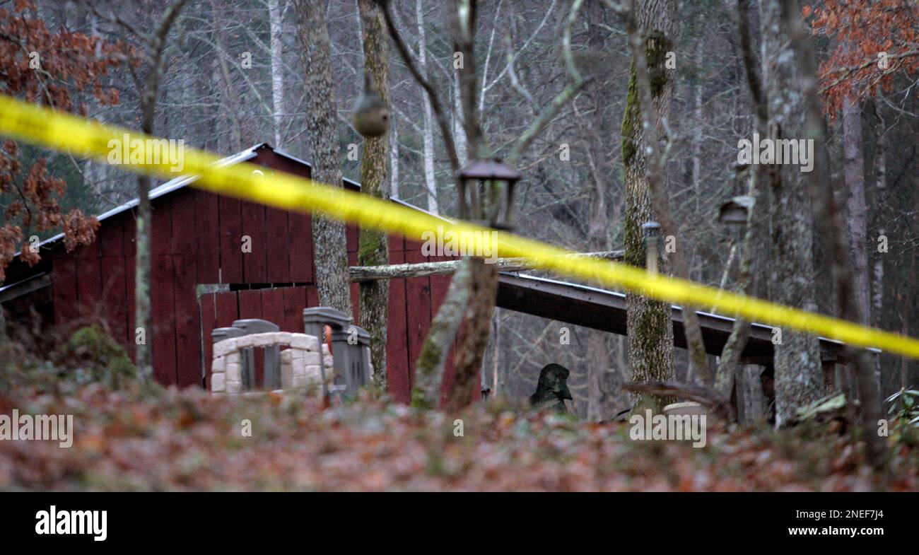 Crime scene tape surrounds an out building near the home that was the ...