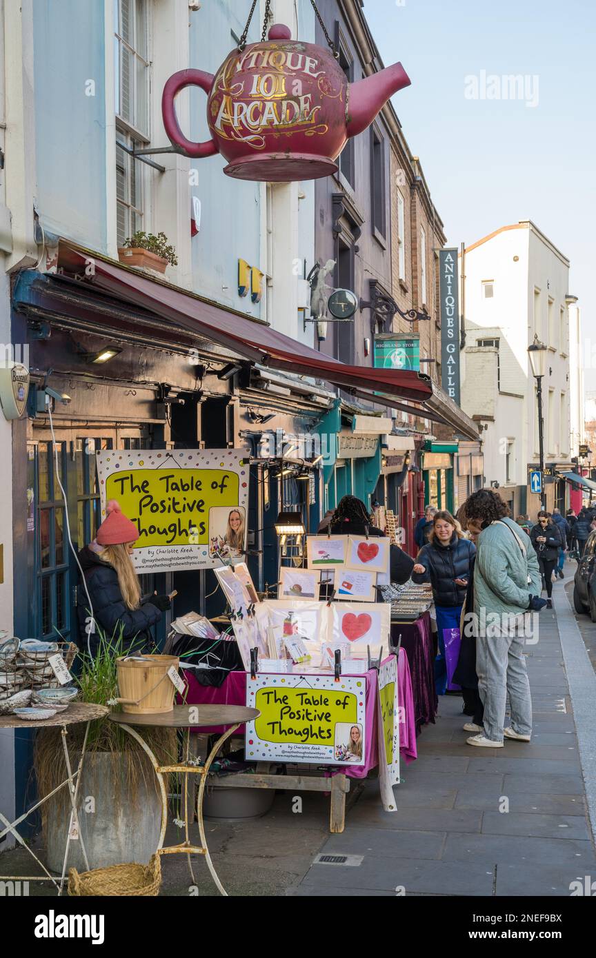 People browsing street market stalls outside the Red Teapot Arcade on ...