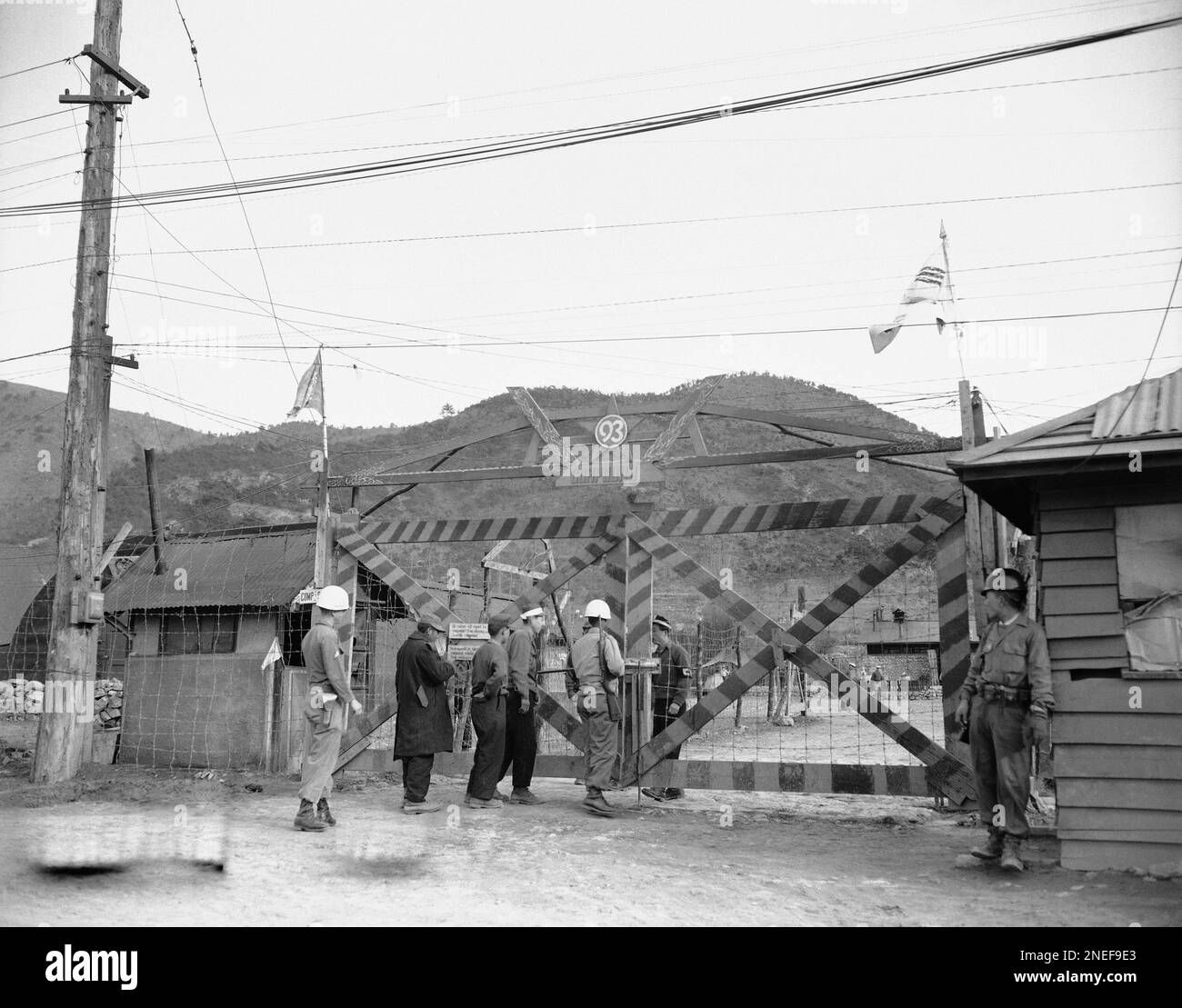 A platoon of ROK soldiers passes the entrance to compound #93 on South ...