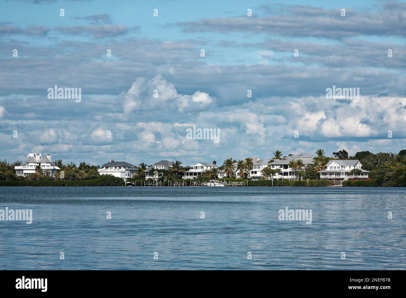 shoreline, houses, residential, docks, green vegetation, boat, blue ...