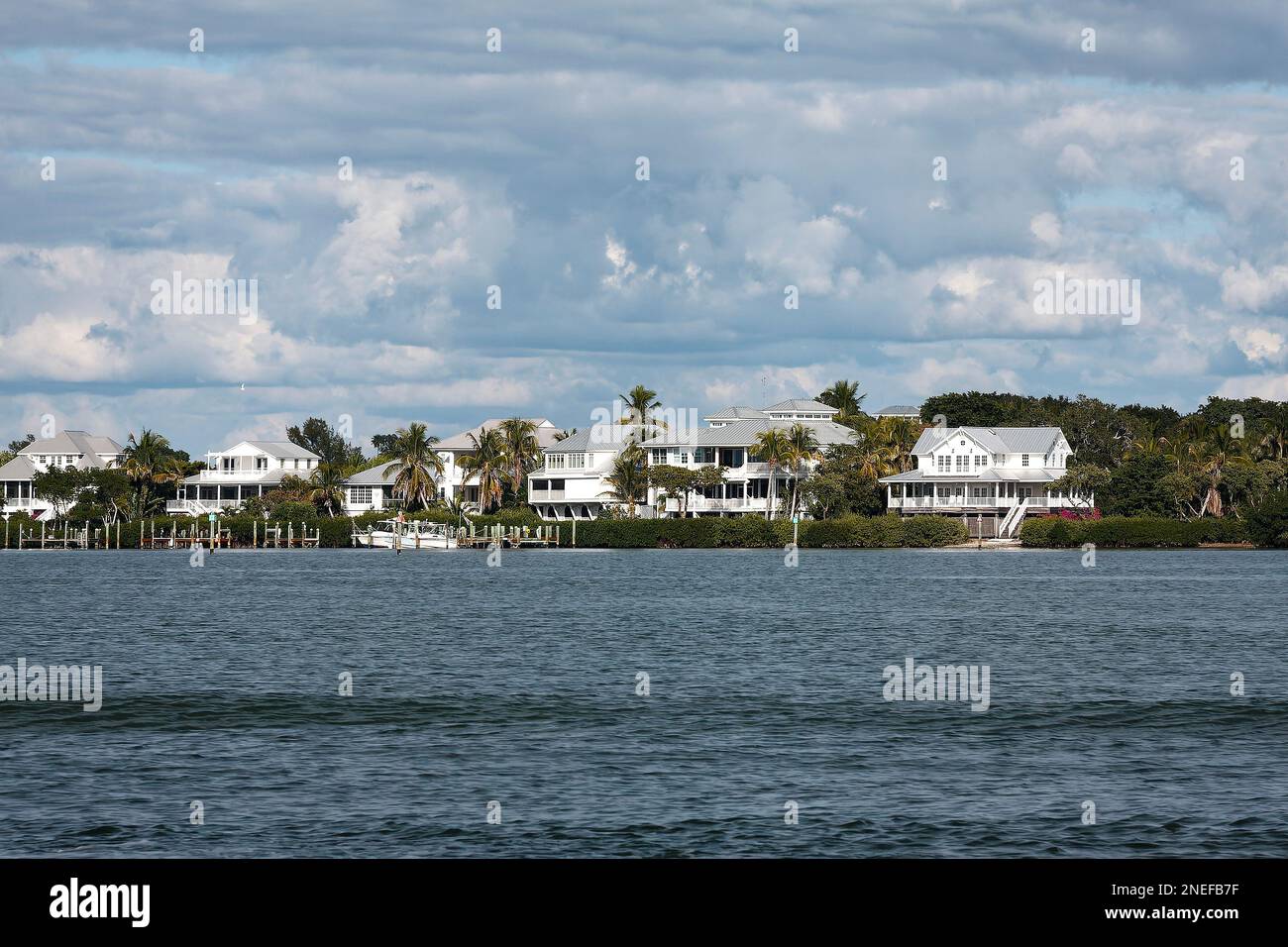 shoreline, houses, residential, docks, green vegetation, boat, blue ...