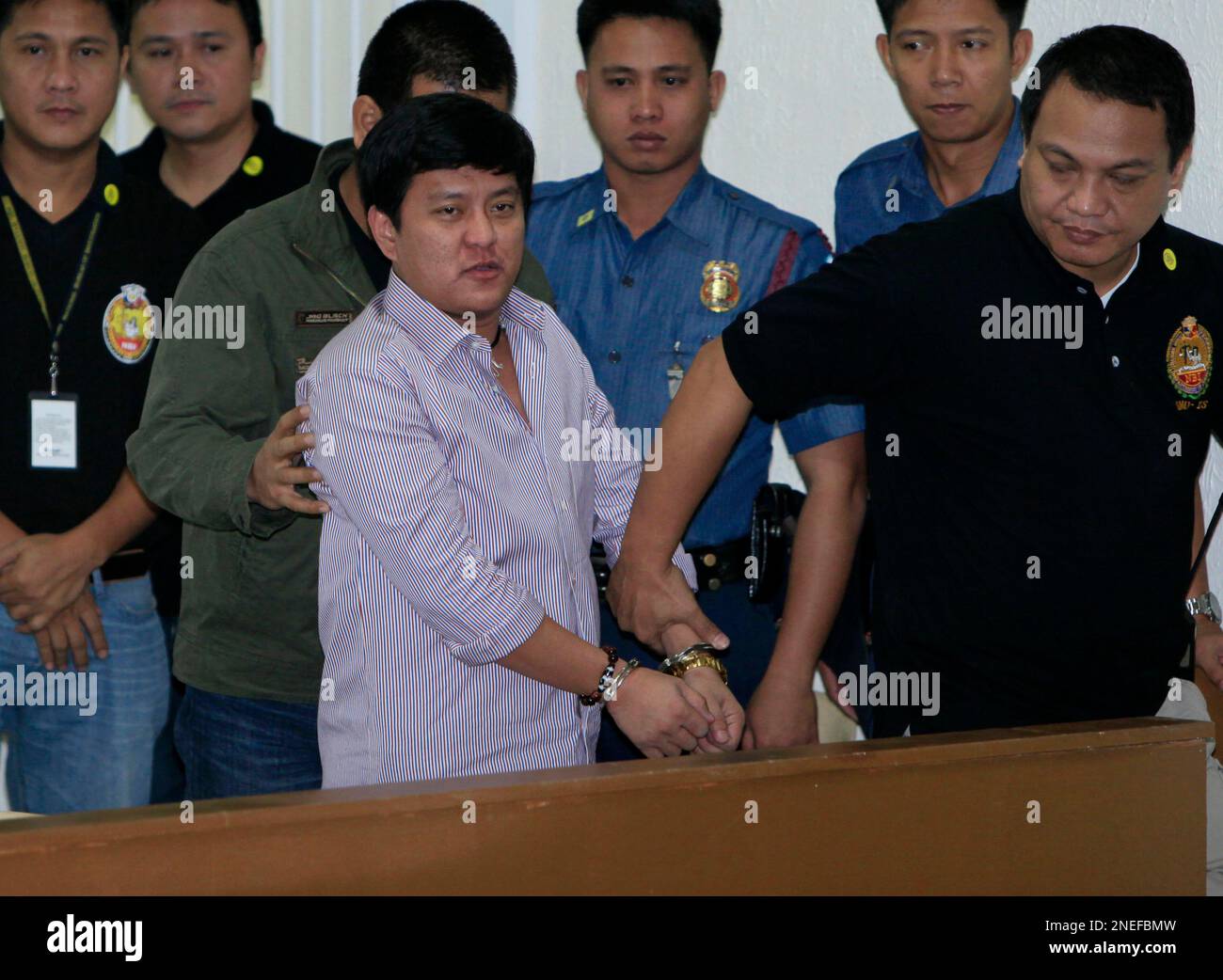 Andal Ampatuan Jr., center, the prime suspect in the massacre of 57 ...