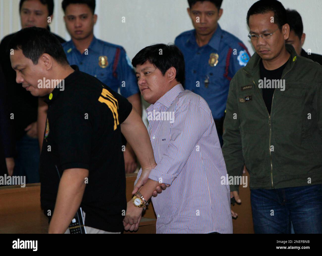 Andal Ampatuan Jr., center, the prime suspect in the massacre of 57 ...
