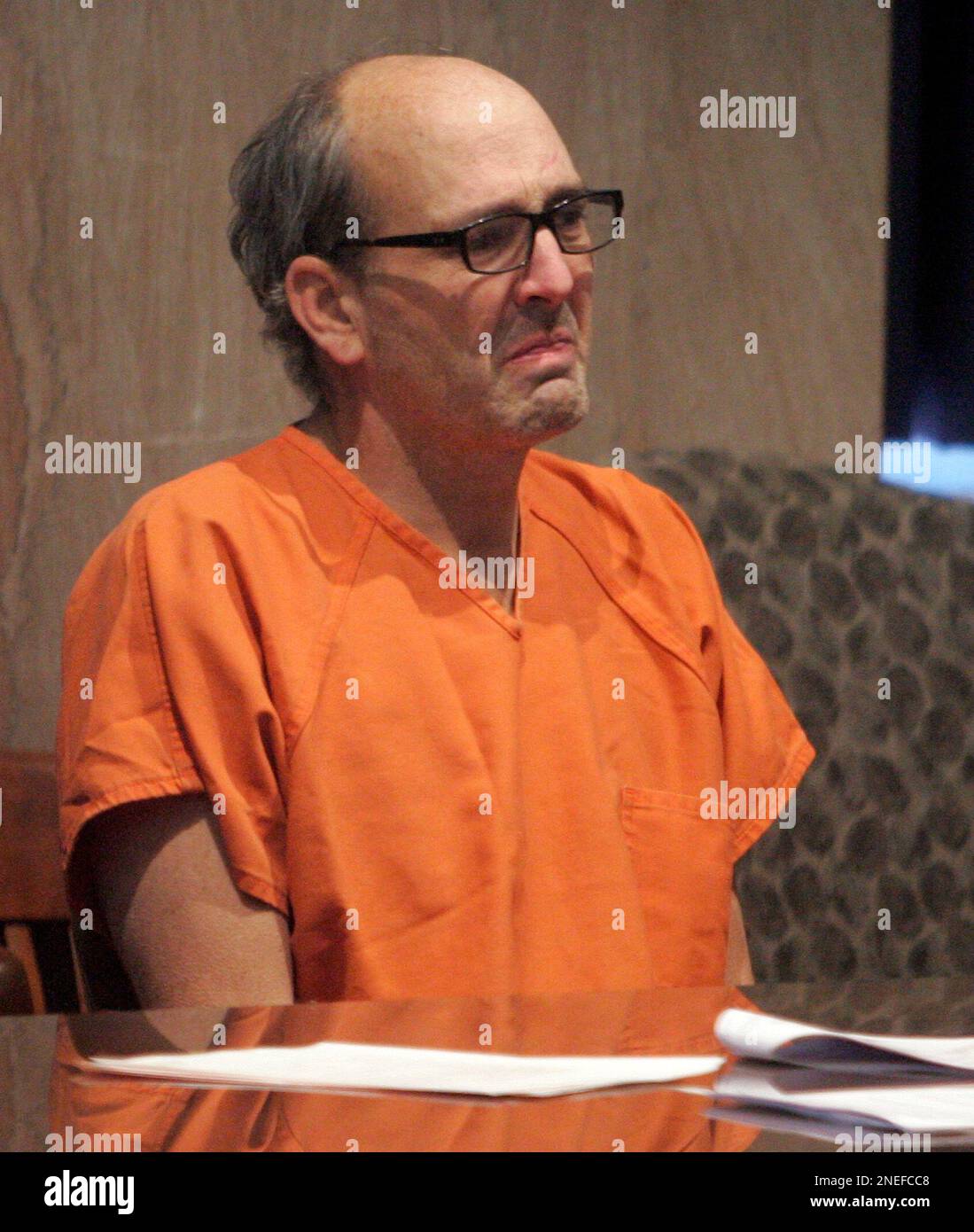 Dr. Stephen Wolf waits for the start of his competency hearing in ...