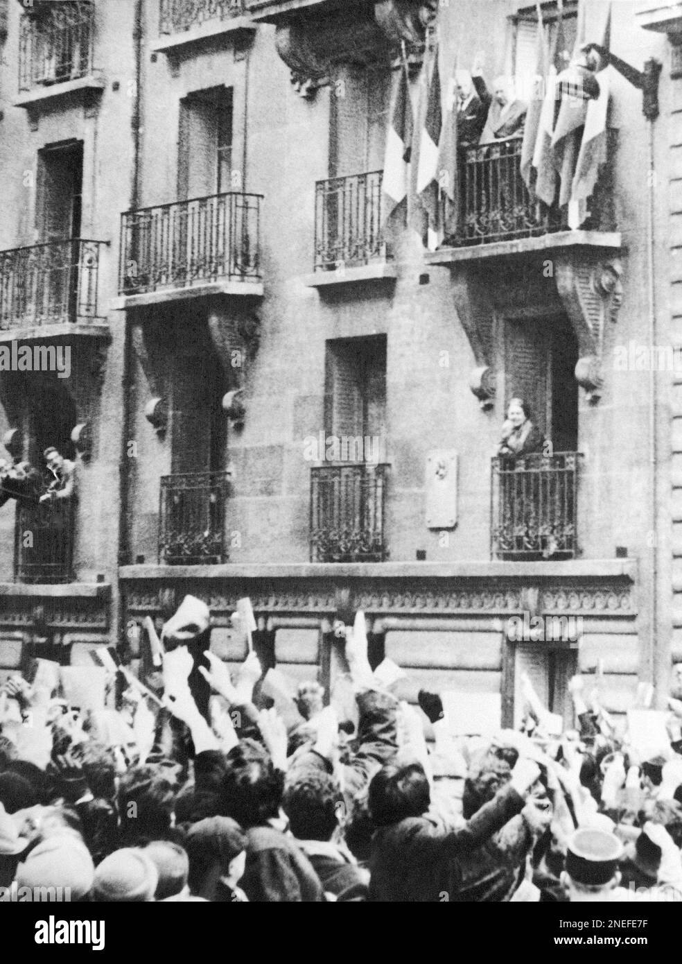 Soviet Premier Nikita Khrushchev waves to Parisians from flag-decorated ...
