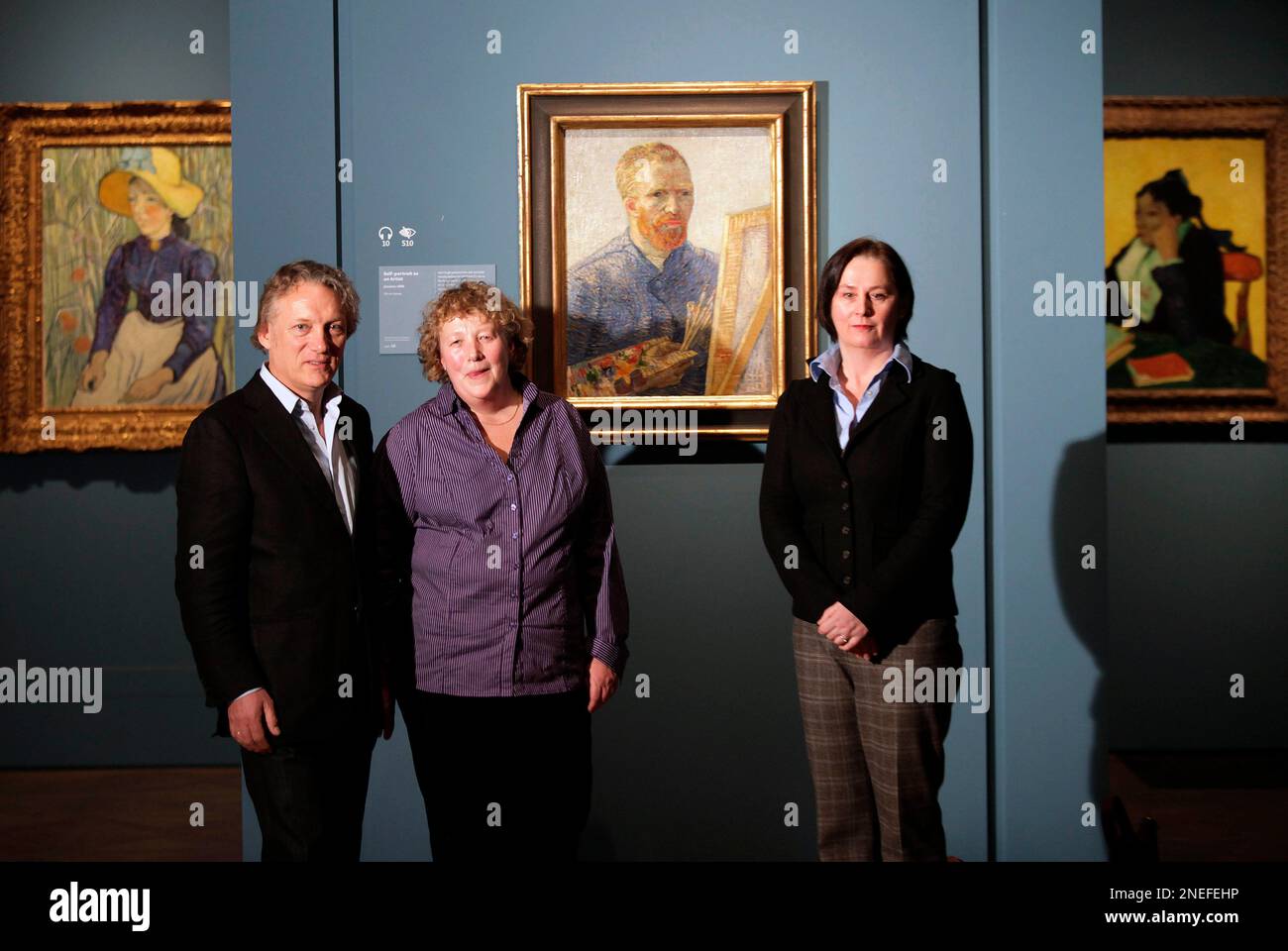 Members of the Van Gogh family pose for photographs in front of a self ...