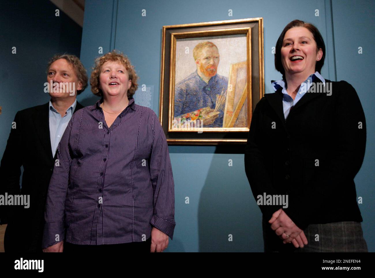 Members of the Van Gogh family pose for photographs in front of a self ...