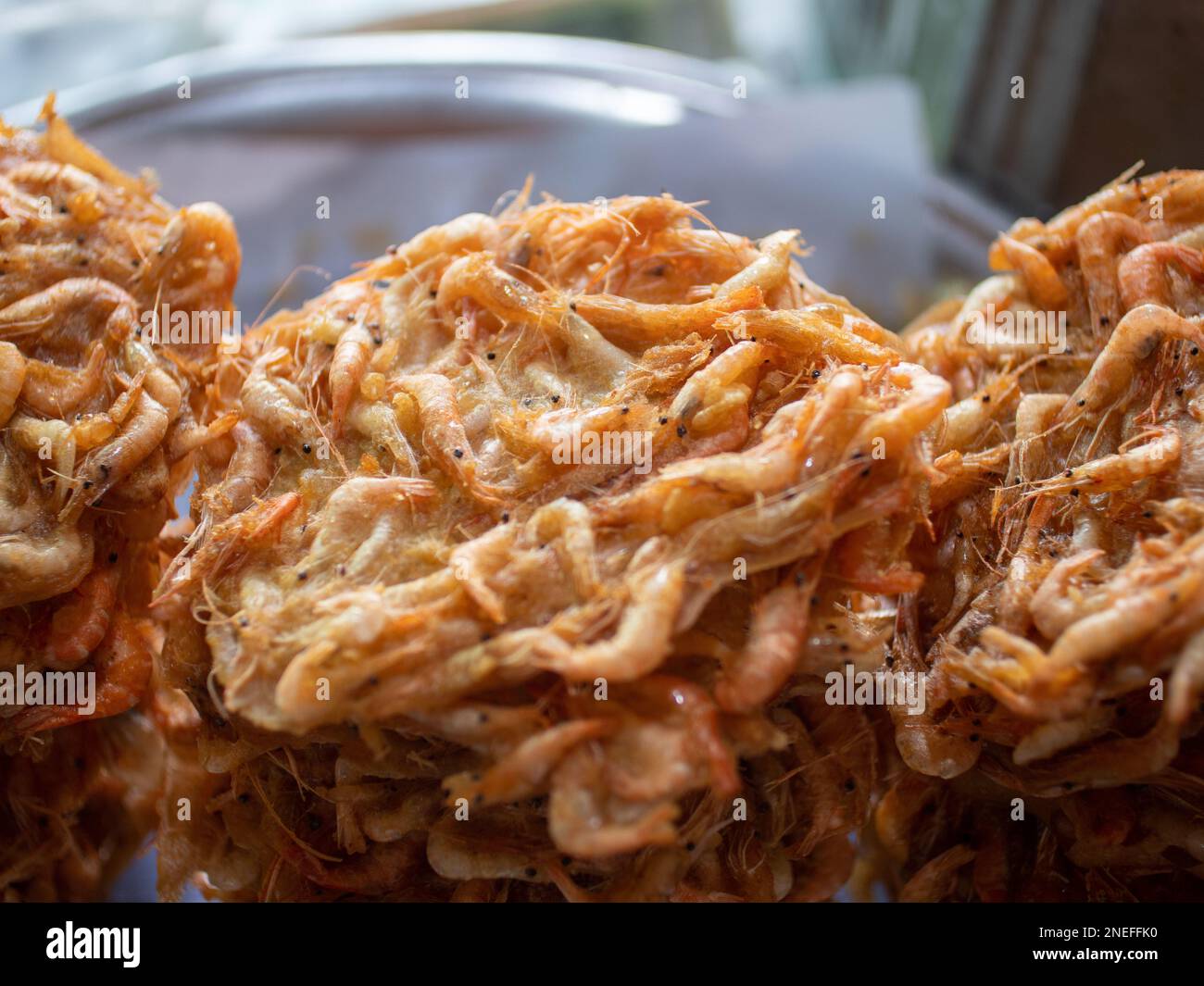 A crispy fried shrimp fritter on sell in a market in Cambodia Stock ...