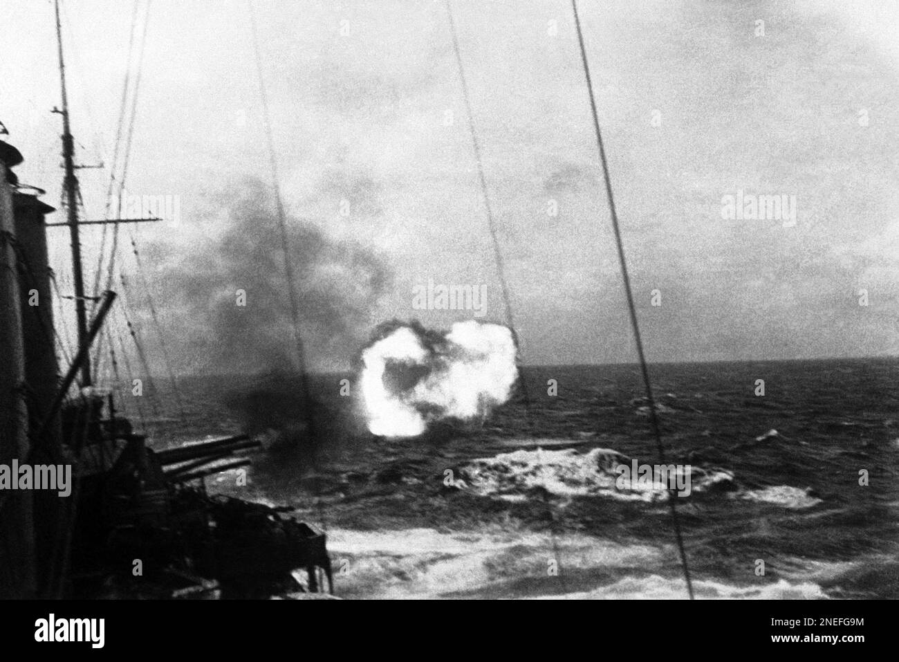 Britain's H.M.S. Norfolk’s mighty guns firing during her action against ...