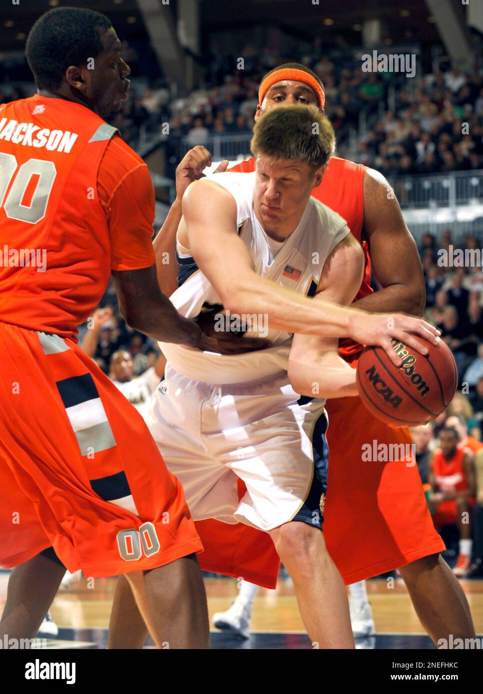 Notre Dame forward Luke Harangody, center, is surrounded by Syracuse ...
