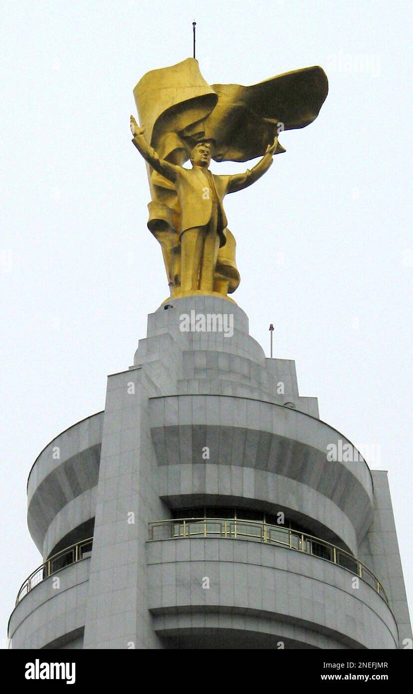 FILE- In this Jan. 19, 2003, file photo a gilded statue of Turkmenistan ...