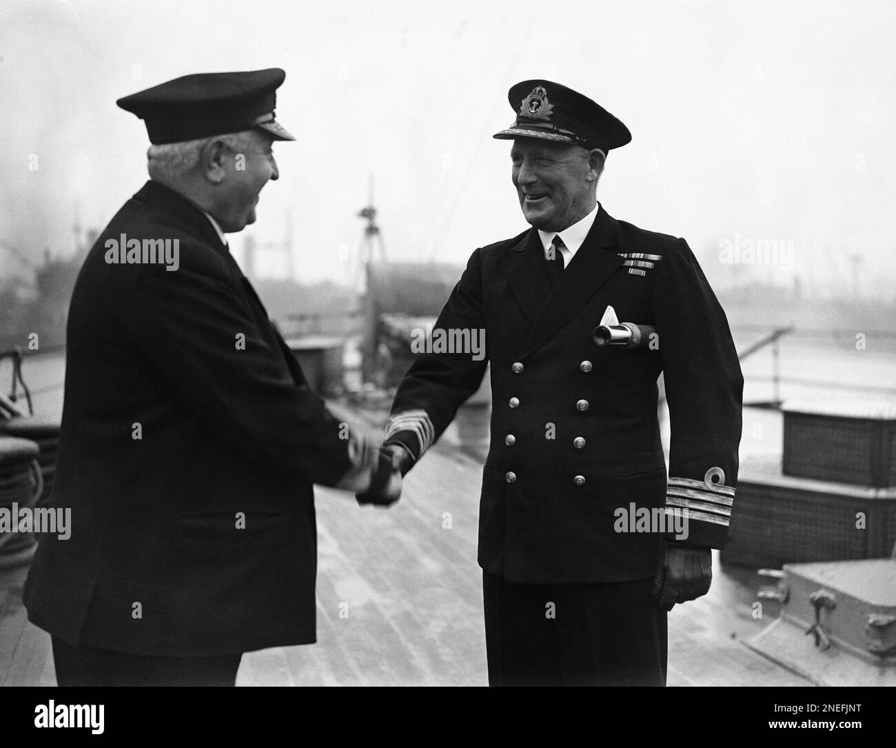 Captain B.C.S. Martin, right, the captain of the British heavy cruiser ...