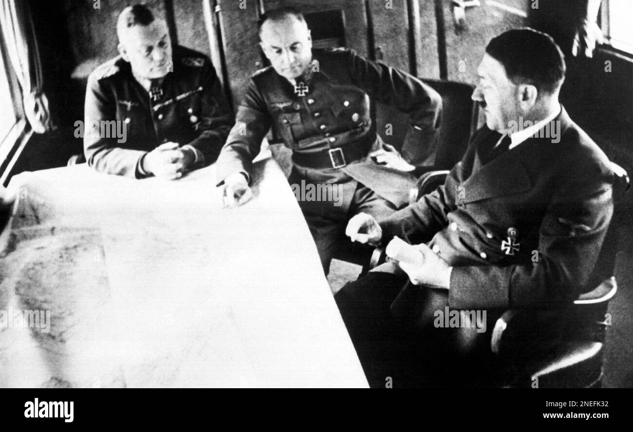 German Chancellor Adolf Hitler, right, discusses the Balkan War ...