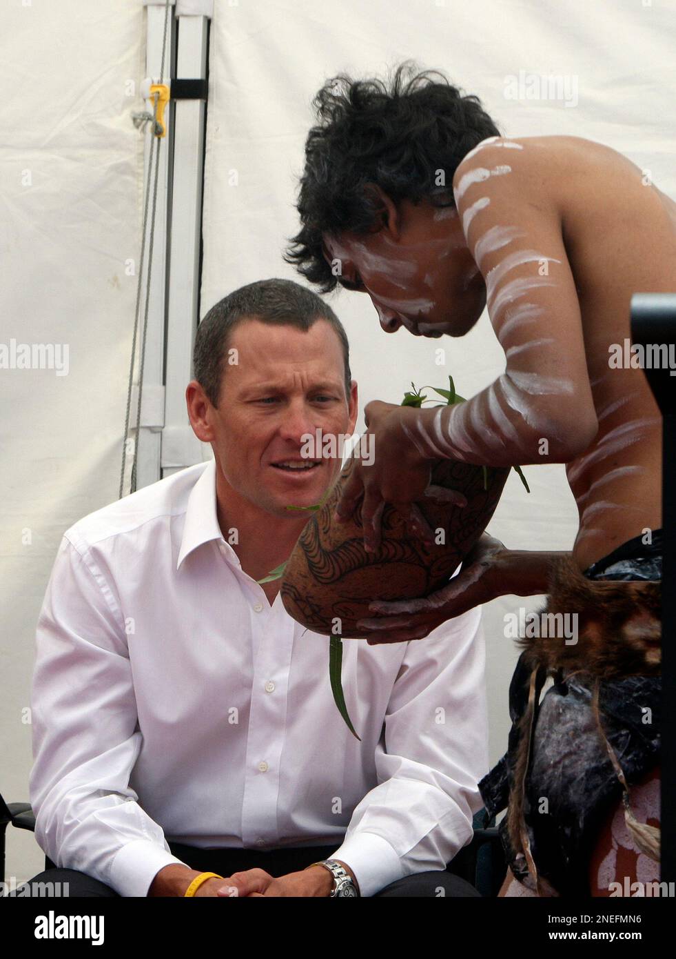 American Lance Armstrong is shown the aboriginal ceremonial flame in ...