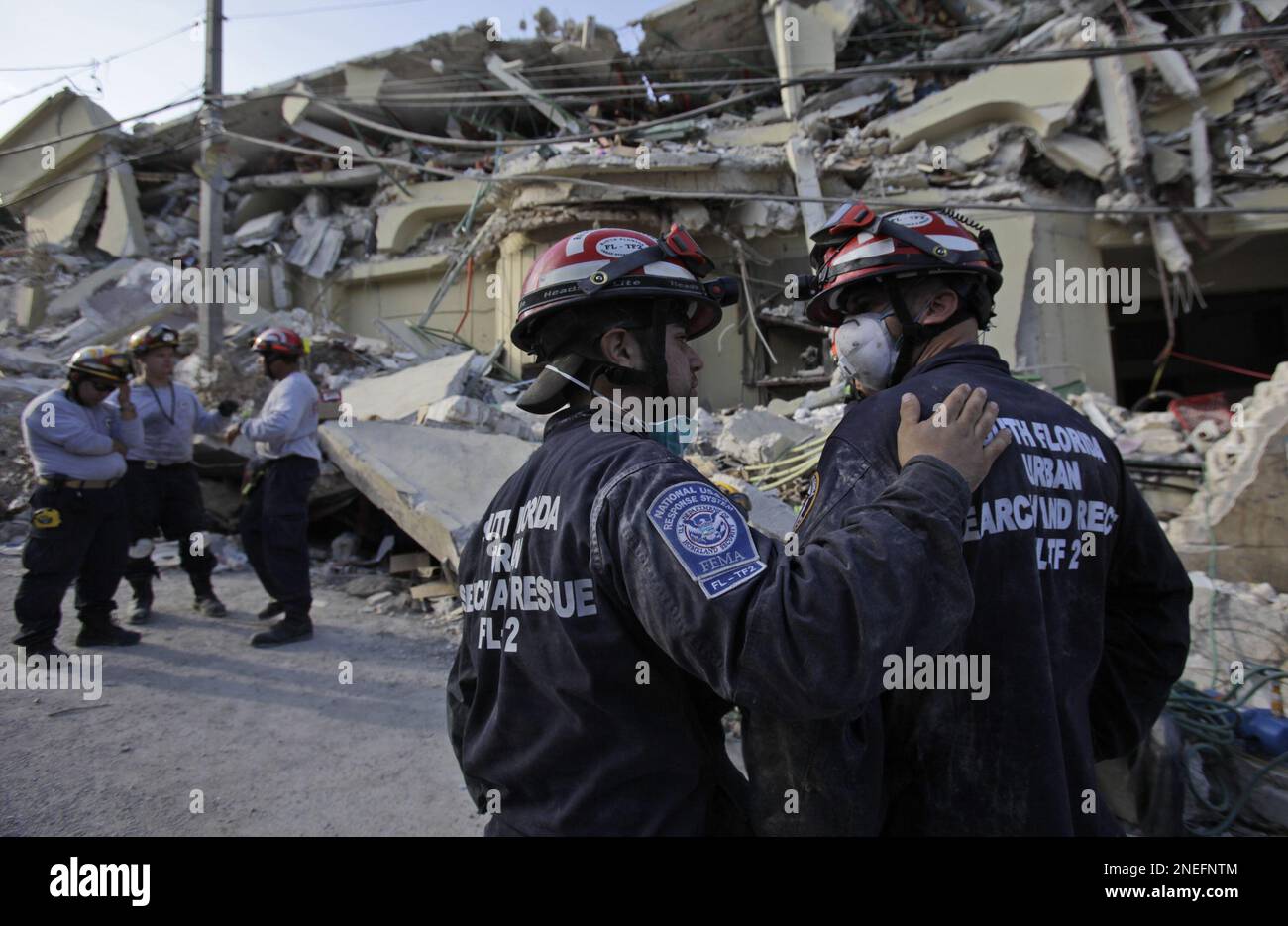 South Florida Search and Rescue Team members Carlo Soldevilla, left ...