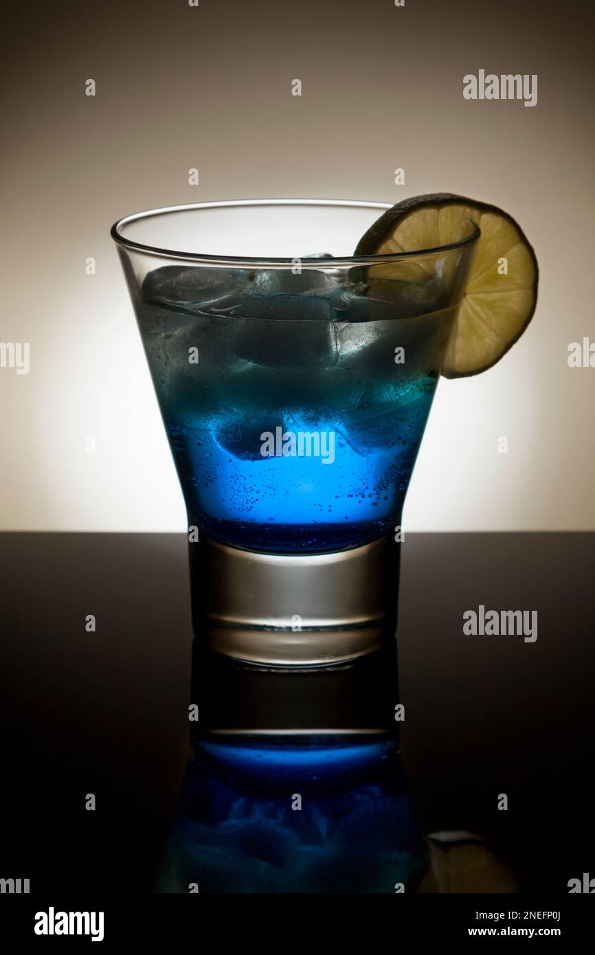 Blue lagoon cocktail in a backlit glass Stock Photo - Alamy