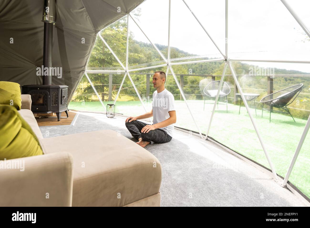 young man resting outside the city in glamping Stock Photo - Alamy