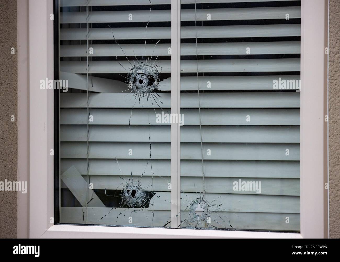 Bullet holes in a window of a property on Fort Terrace in Bangor. An ...