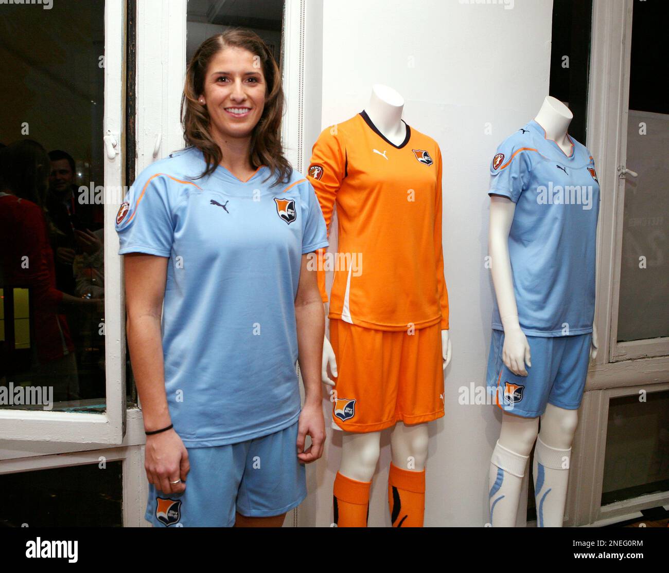 Puma athlete Amy Rodriguez, left, models the 2010 uniform for the ...