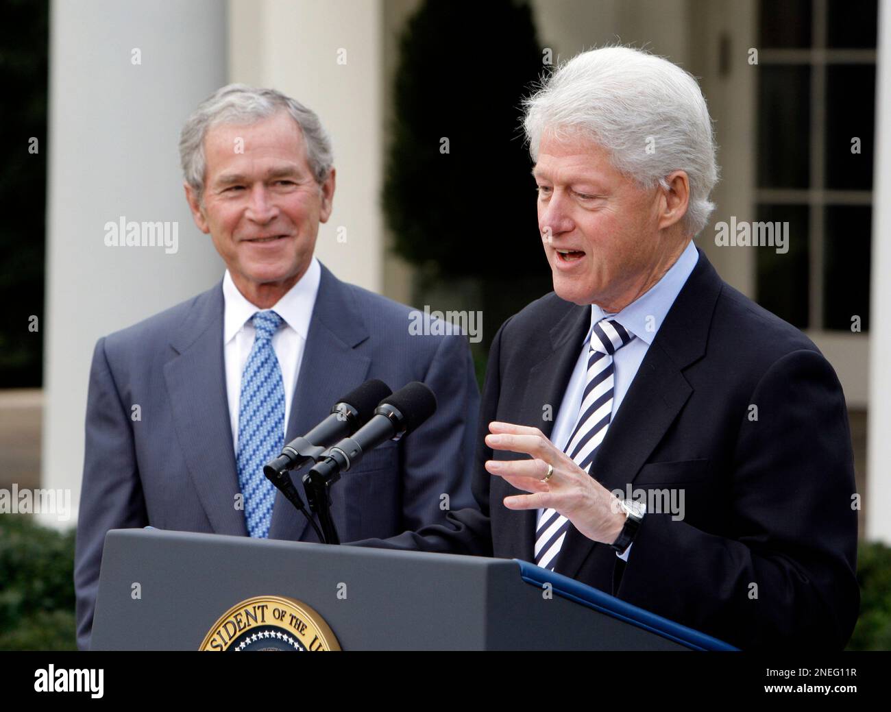 Former President Bill Clinton speaks as former President George W. Bush ...