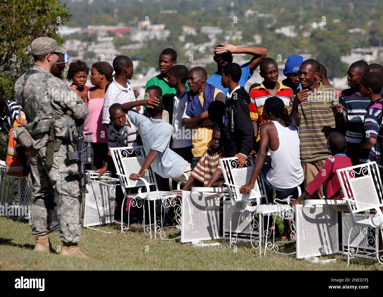 U.S. soldiers with the 82nd Airborne Division stand guard as earthquake ...