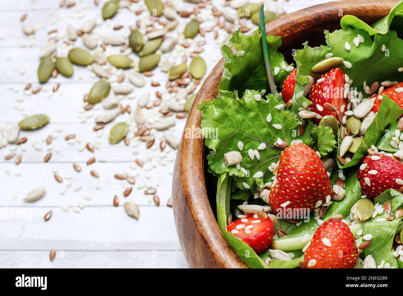 diet summer salad with strawberries, lettuce and seeds, a light snack ...