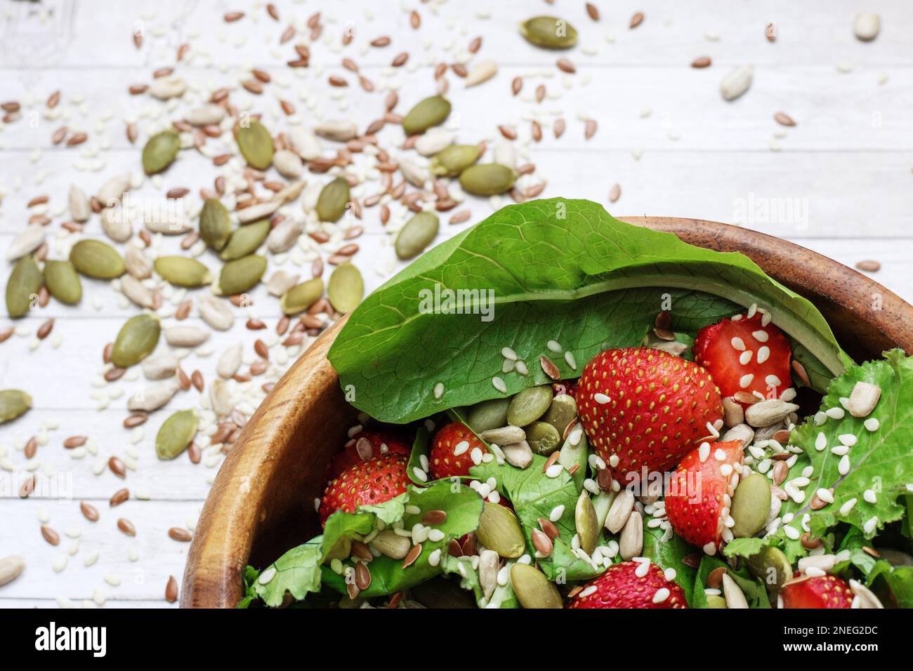 diet summer salad with strawberries, lettuce and seeds, a light snack ...