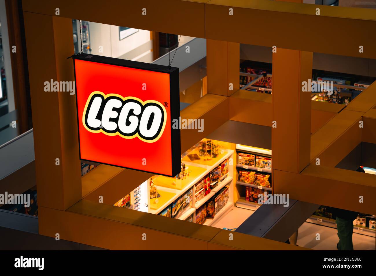 Lego store logo in a shopping mall. The Lego Group is a toy production ...