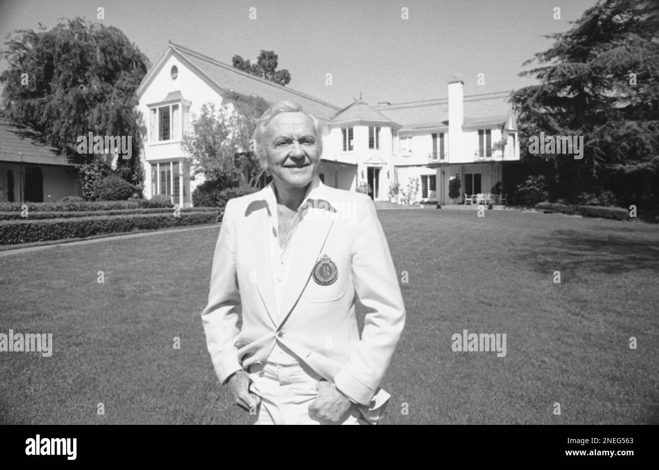Actor and bandleader Charles ?Buddy? Rogers stands in front of the home ...