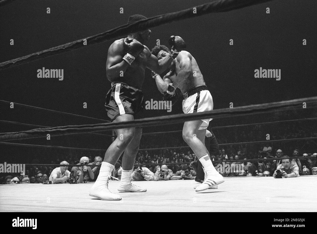 Joe Frazier follows through with his left that lifts Jimmy Ellis off ...