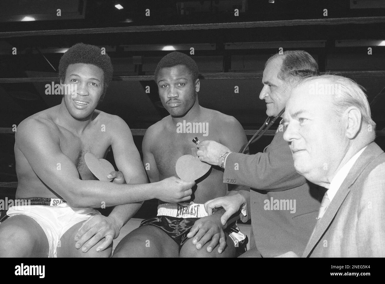 Jimmy Ellis, left, and Joe Frazier gag things up by placing cardboard ...