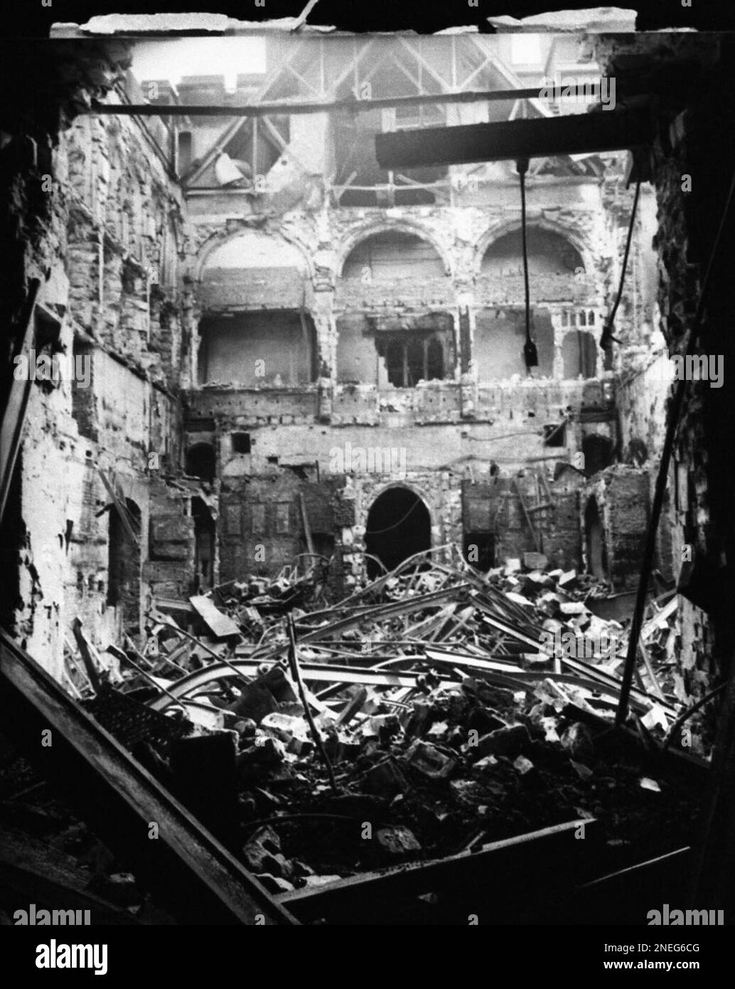 Tangled steelwork, shattered masonry, charred timbers in the interior ...