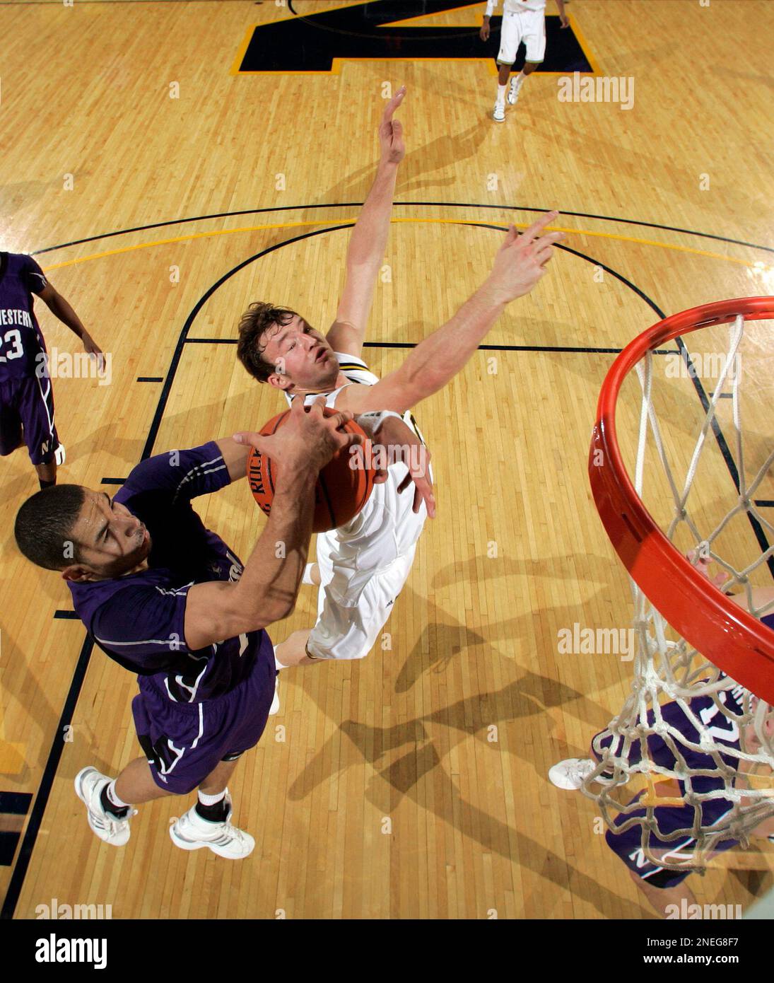 Northwestern guard Drew Crawford, bottom left, wins a rebound from ...