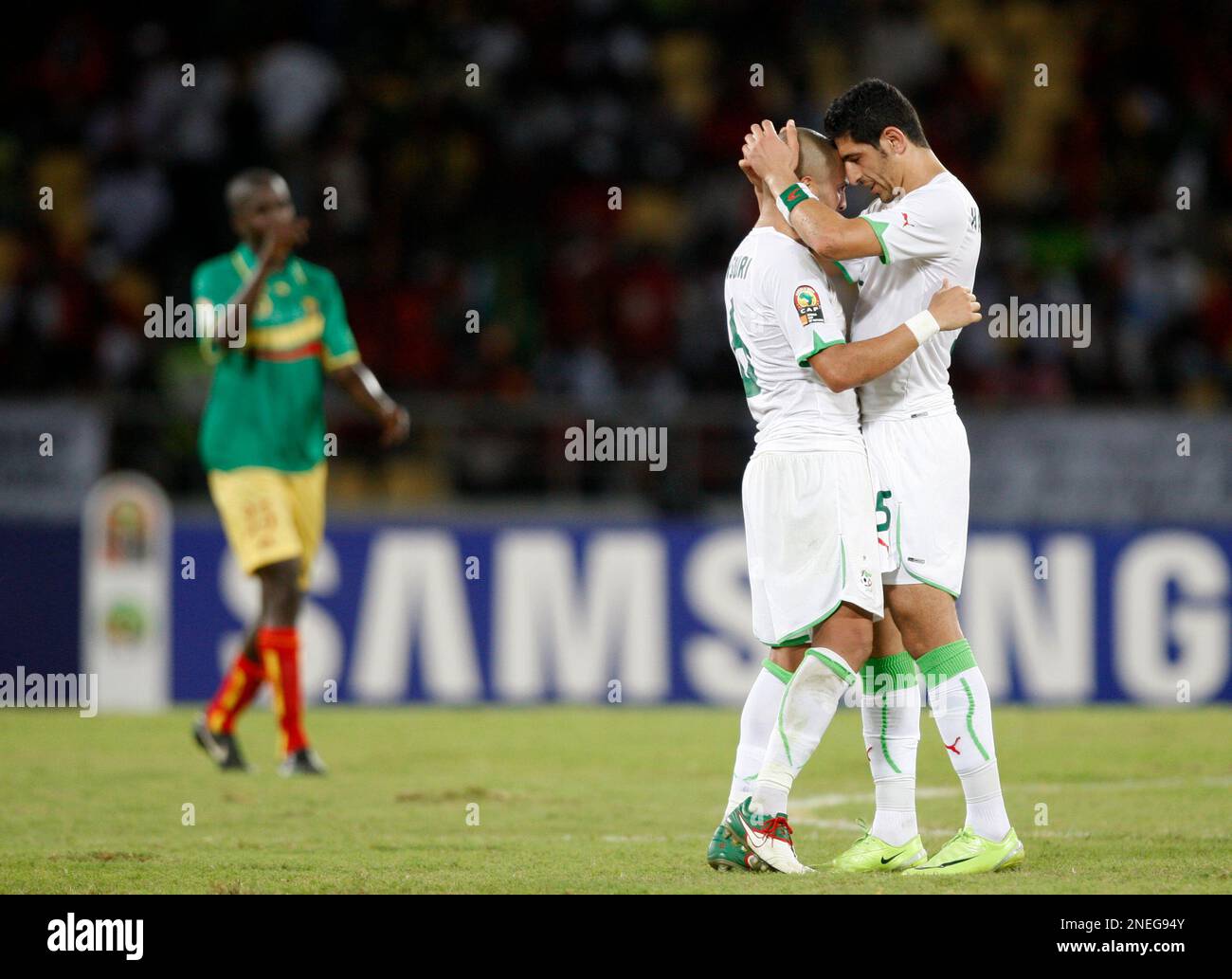 Algeria's Rafik Halliche, right, and Yazid Mansouri celebrate their 1-0 ...